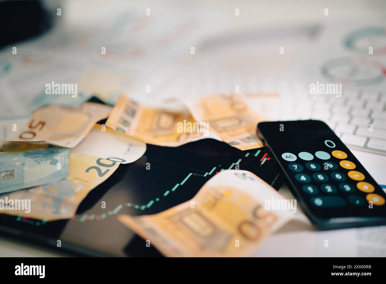 Stock charts displays. Office space interior. Graphic tablet calculator ...