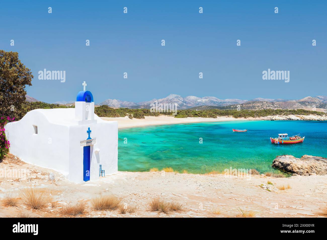 A traditional Greek church by the beach at Alyko on the Greek island of ...