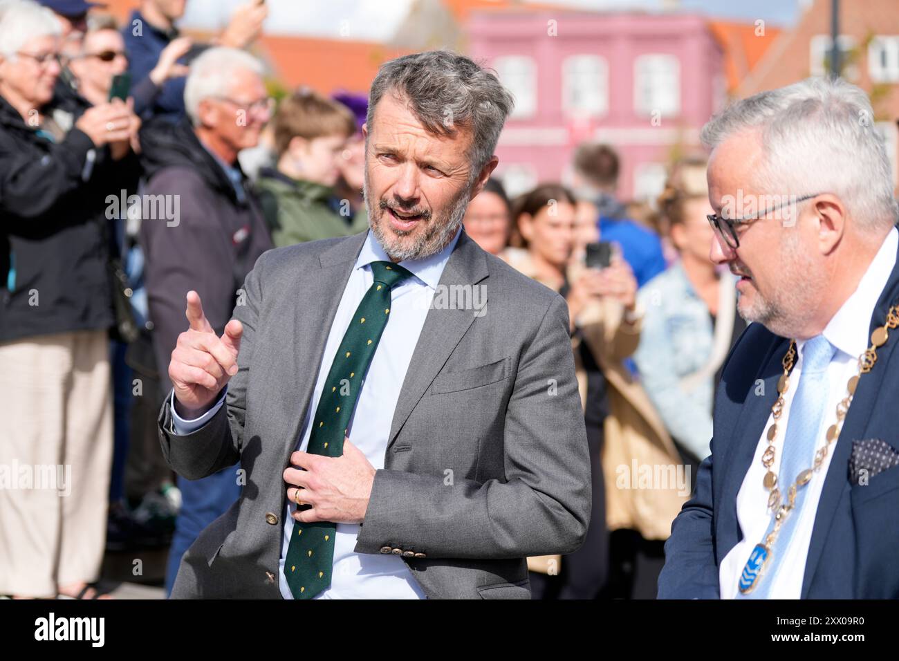 Assens, Denmark. 21st Aug, 2024. King Frederik in conversation with Mayor Soeren Steen Andersen ...
