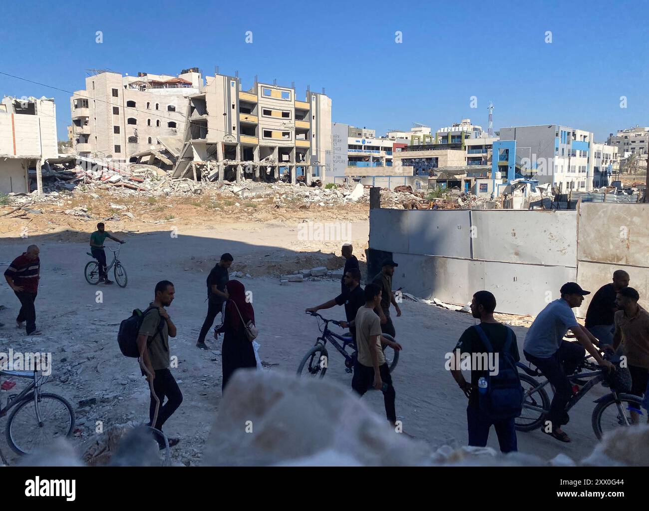 Palestinian residents conduct an search and rescue operations among the ...
