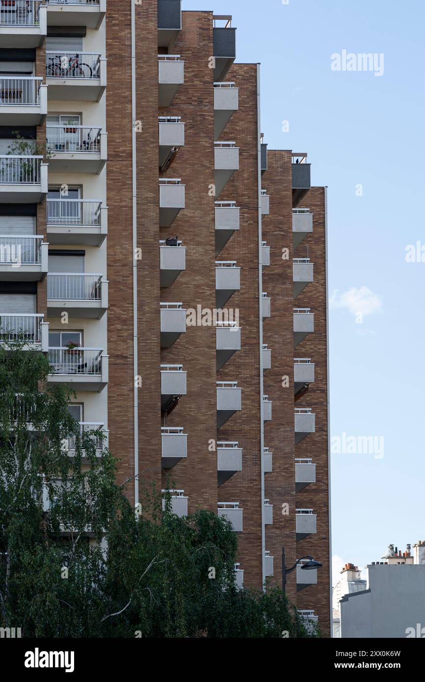 Paris, France - 07 20 2024: View of a red brick building facade with ...