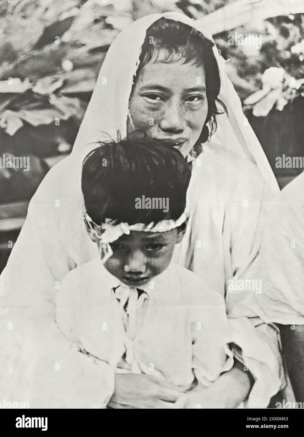 Vietnam War. Bring soroow and grief to a mother and son at the father's funeral. South Vietnam ...