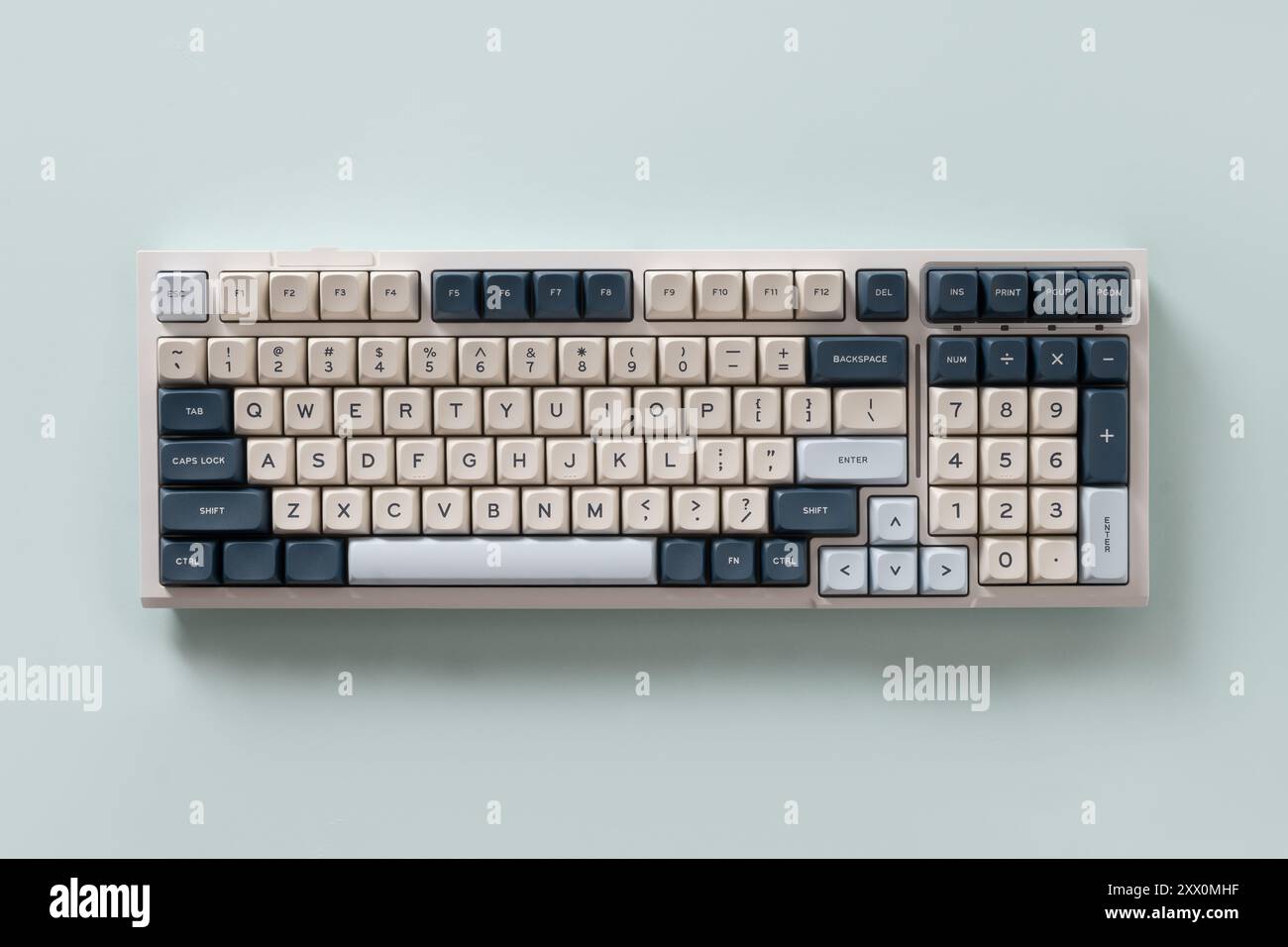 Modern mechanical keyboard isolated on blue background. Minimal style ...