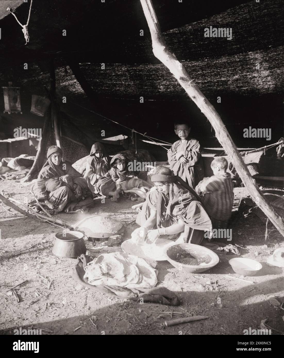 Life in Palestine in the early 20th century. Bedouin woman baking bread ...
