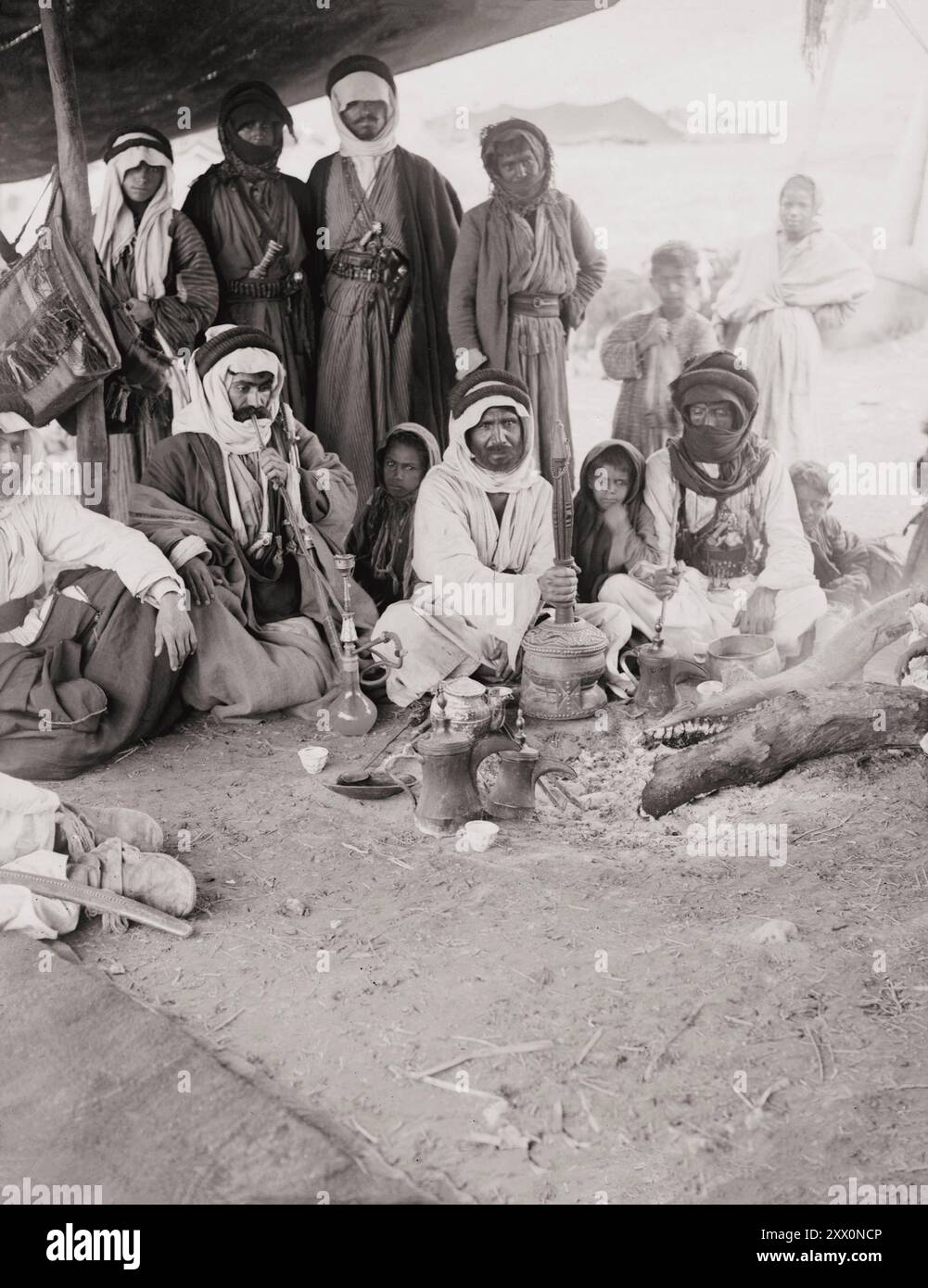 Life in Palestine in the early 20th century. Bedouins preparing coffee ...