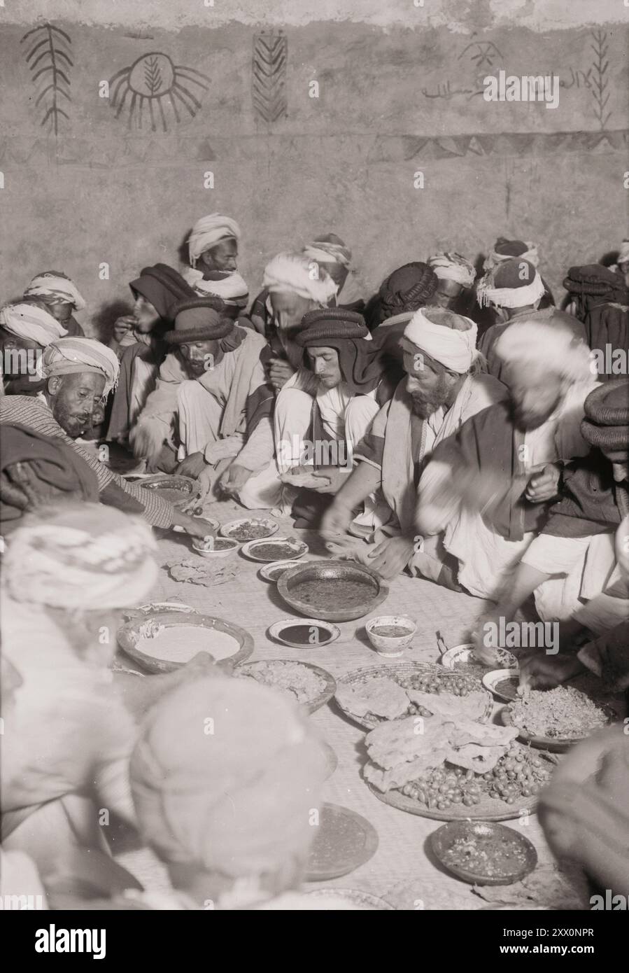 Life in Palestine in the early 20th century. Supper in the guest ...