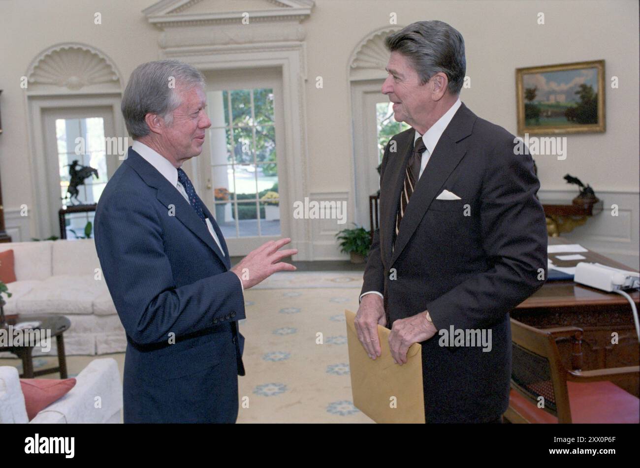 President Reagan meeting President Jimmy Carter in oval office. October ...