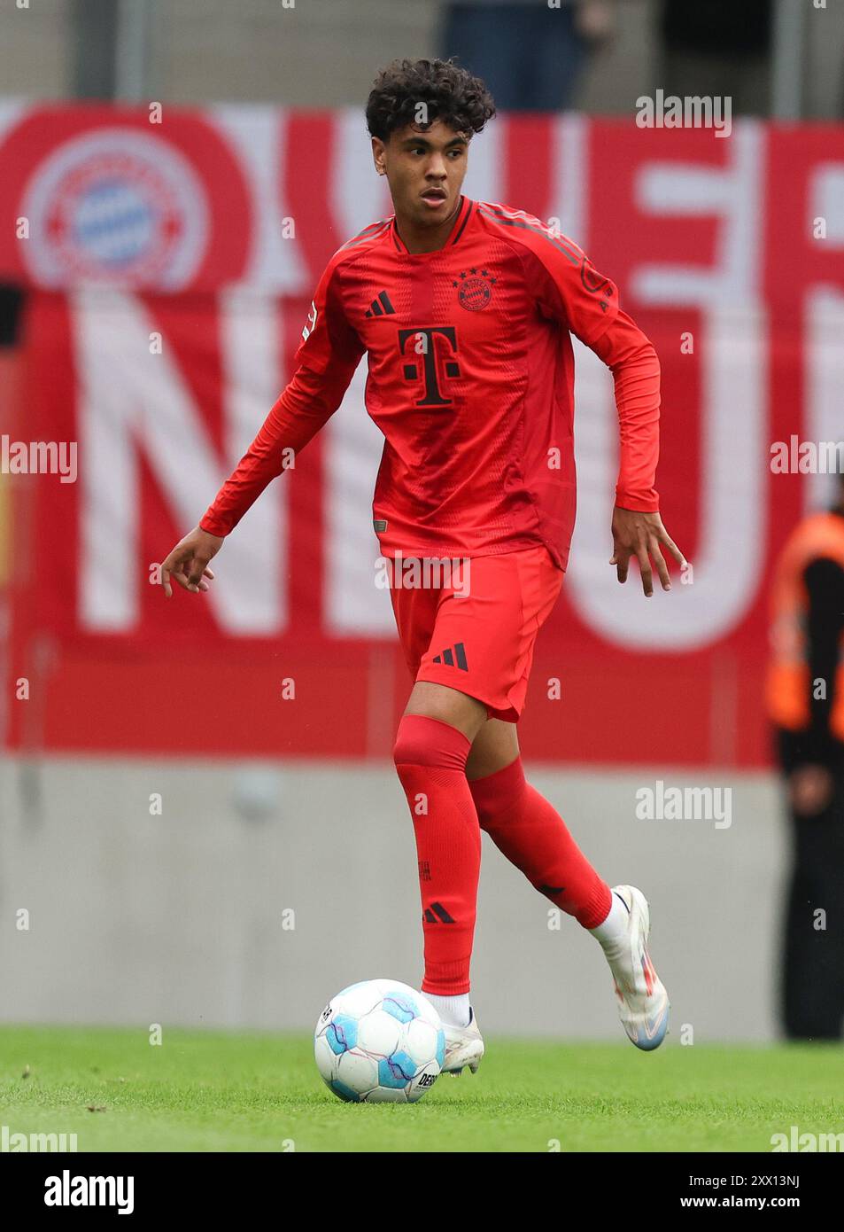 MUNICH, GERMANY - AUGUST 20: Adam Aznou of Bayern Muenchen runs with a ...