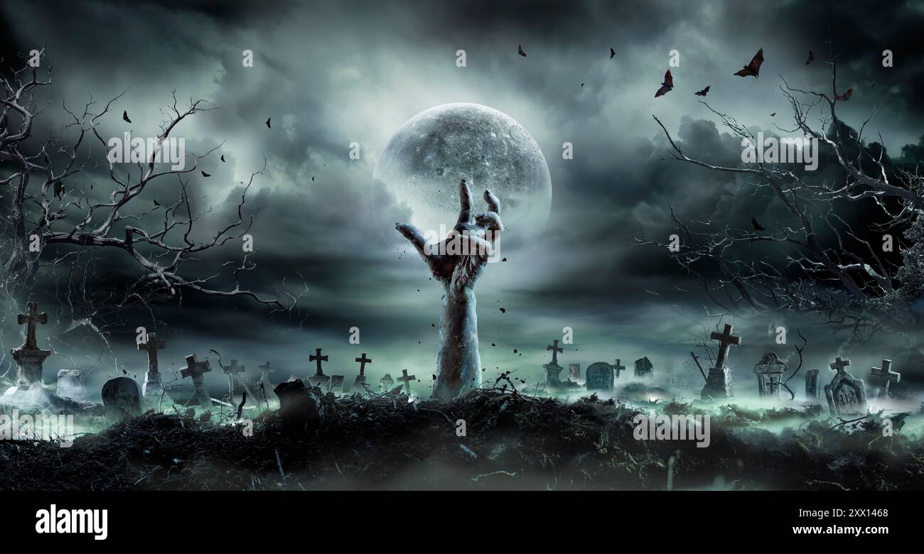 Zombie hand grave cross hi-res stock photography and images - Alamy
