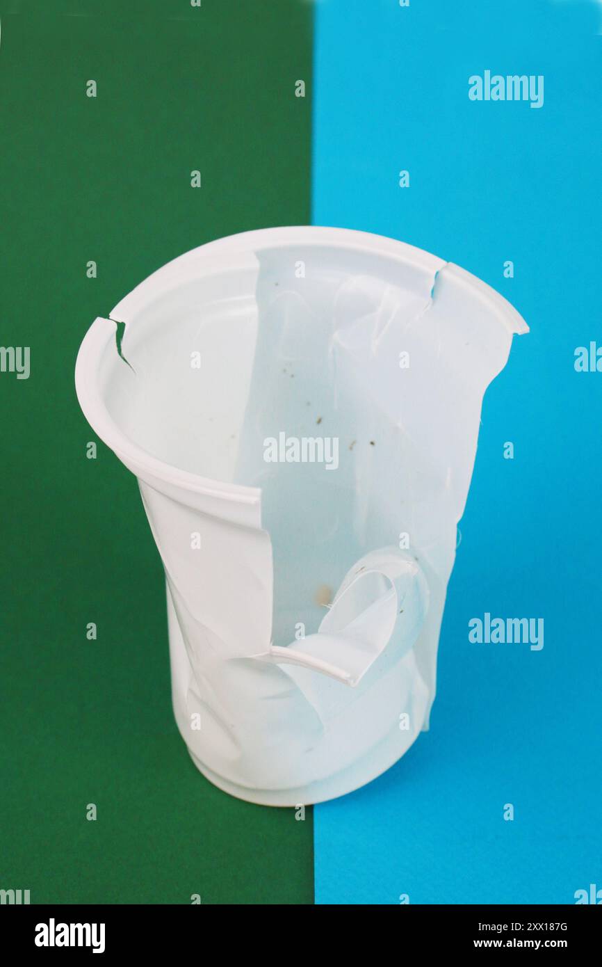 Vertical photo of a damaged plastic cup Stock Photo - Alamy
