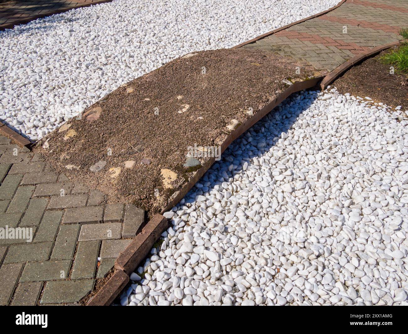 Decorative bridge over an imitation stream made of white pebbles Stock ...