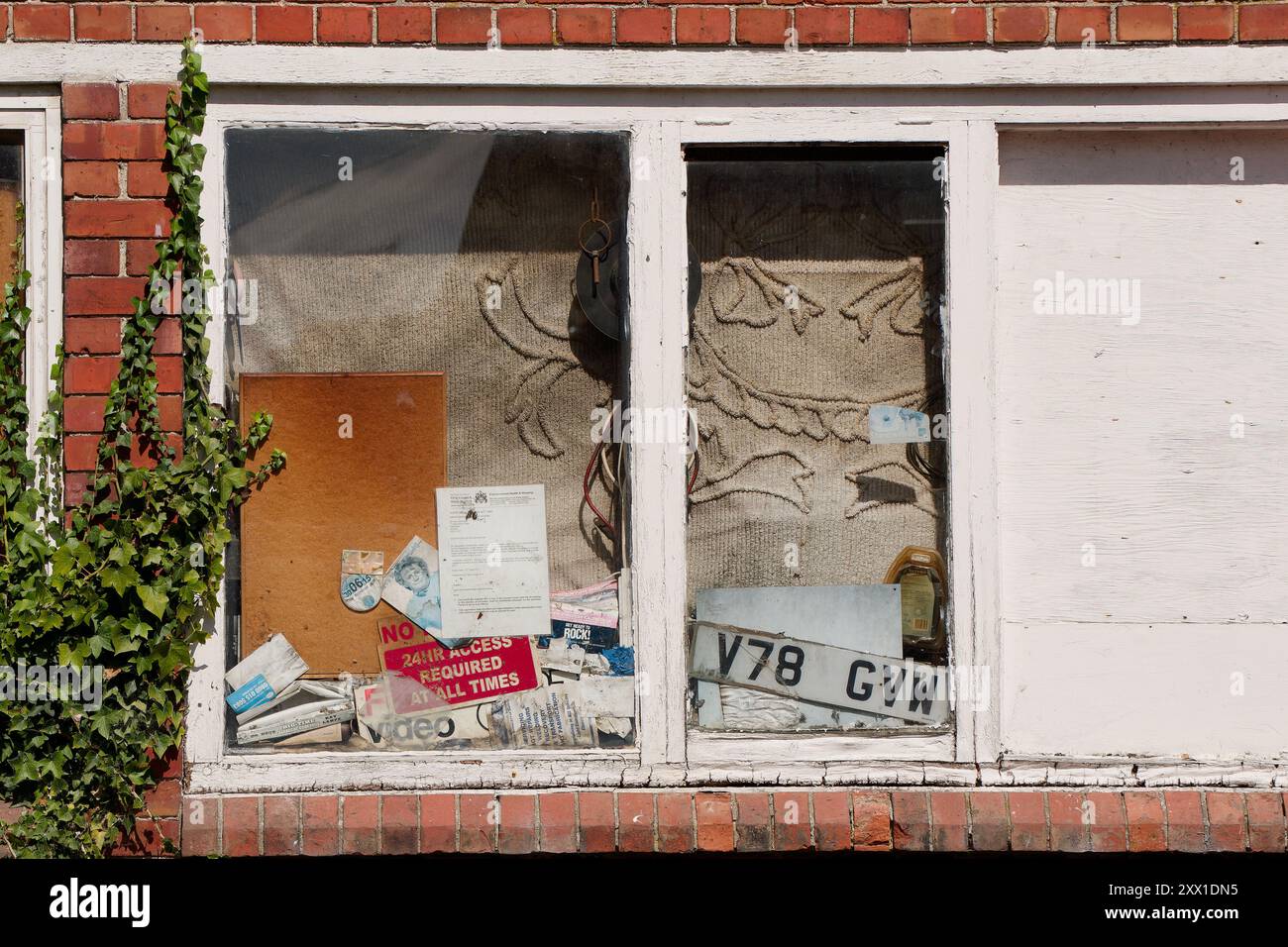 Old run down garage window example Stock Photo - Alamy
