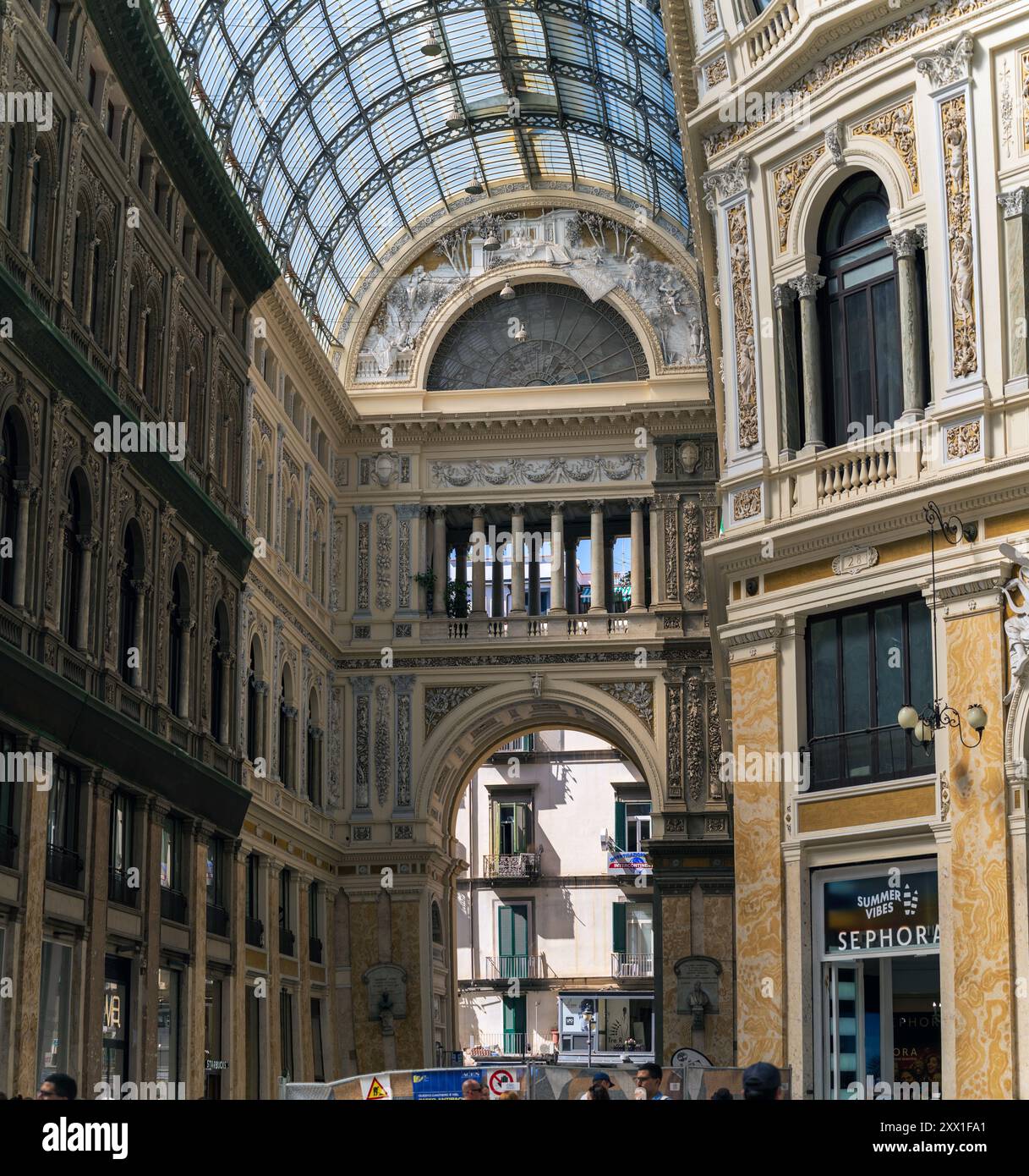 The grand glass dome and intricate design of Galleria Umberto I in ...