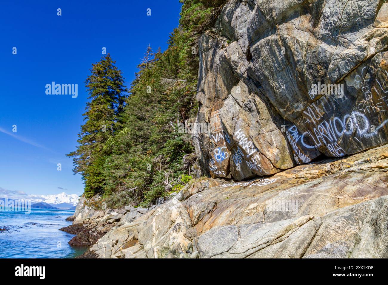 Names of fishing boats painted on the rocks in Cross Sound with the ...