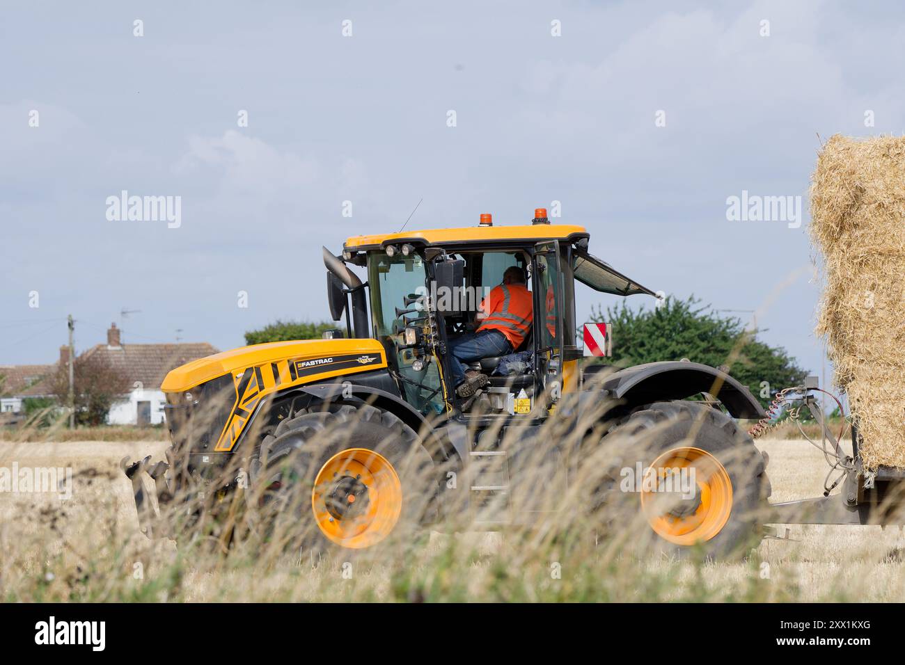 Tractor with a trailer full of hay bales in Hunstanton, Norfolk, UK ...