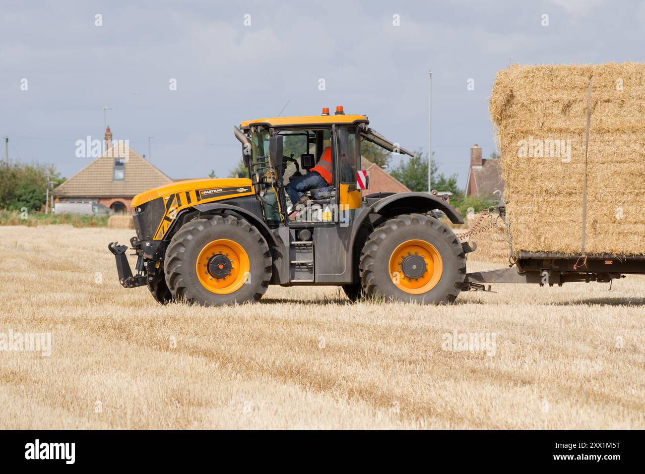 Tractor with a trailer full of hay bales in Hunstanton, Norfolk, UK ...