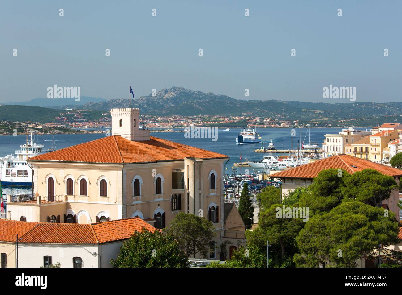 View across tiled rooftops to distant Palau, the Palazzo dell ...