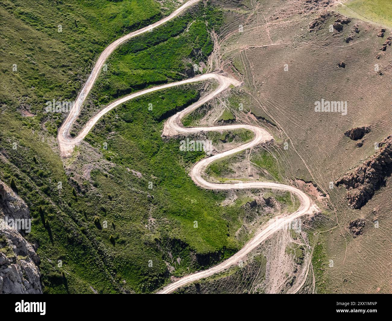 Aerial view of a winding mountain road curves, Kalmak Ashuu Pass ...