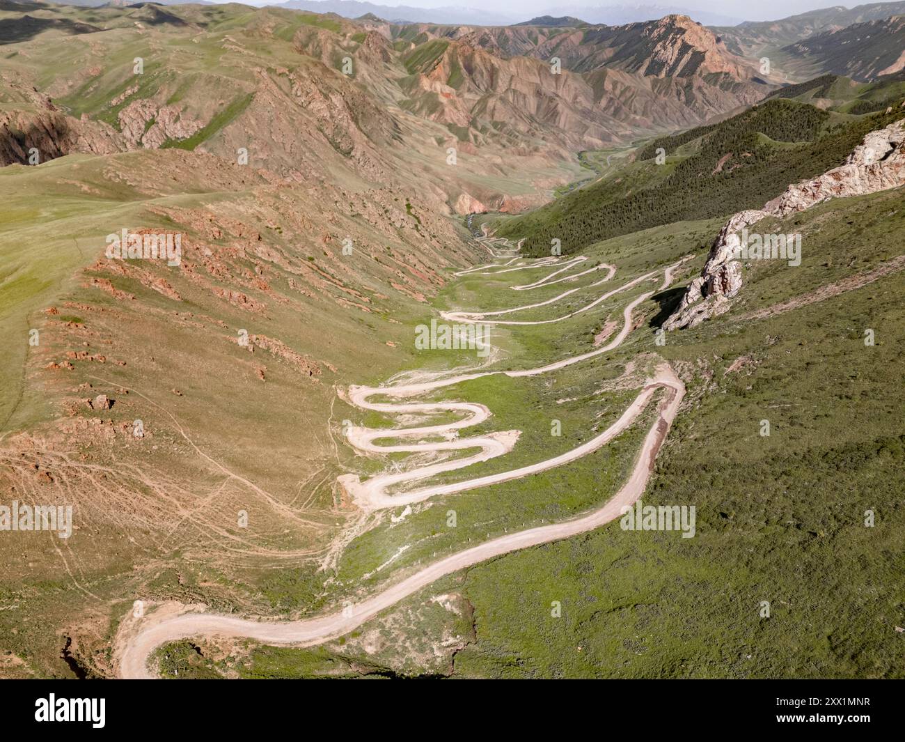 Aerial view of a winding mountain road curves, Kalmak Ashuu Pass ...
