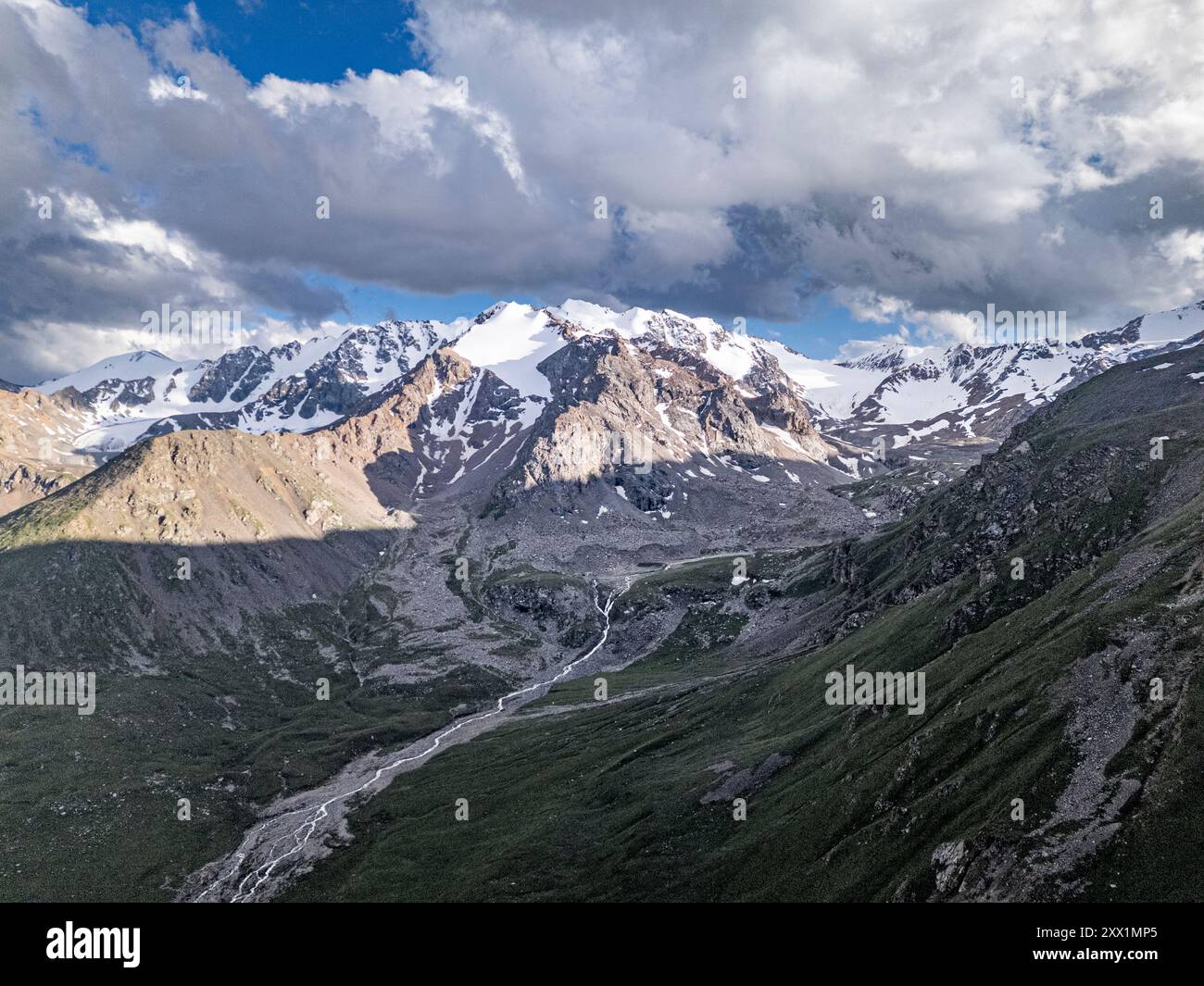 Snow-capped peaks and lush valleys showcased in stunning landscape ...