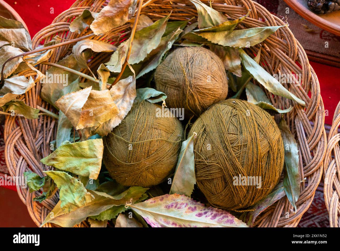 Brown balls of wool and dried leaves as natural dye, Chinchero, Sacred ...
