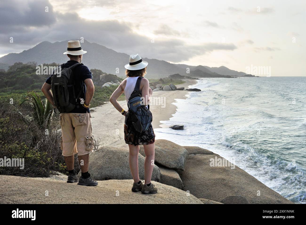 Woman and man admiring the beaches of Arrecifes, Tayrona National ...