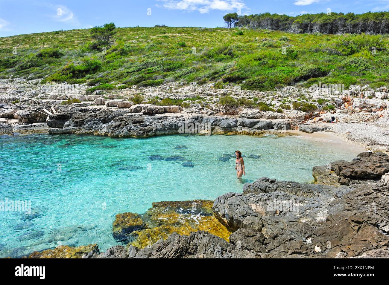 Woman swimming at the small beach of Perna inlet, Palmizana, St ...