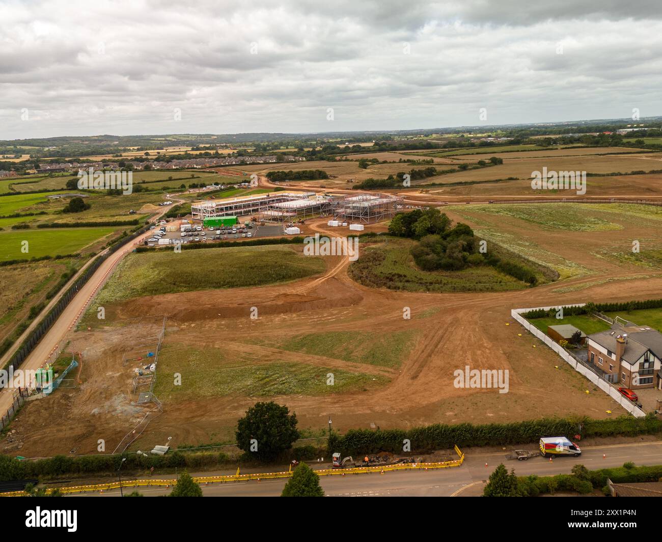 Aerial view of a construction site expanding into the rural countryside ...