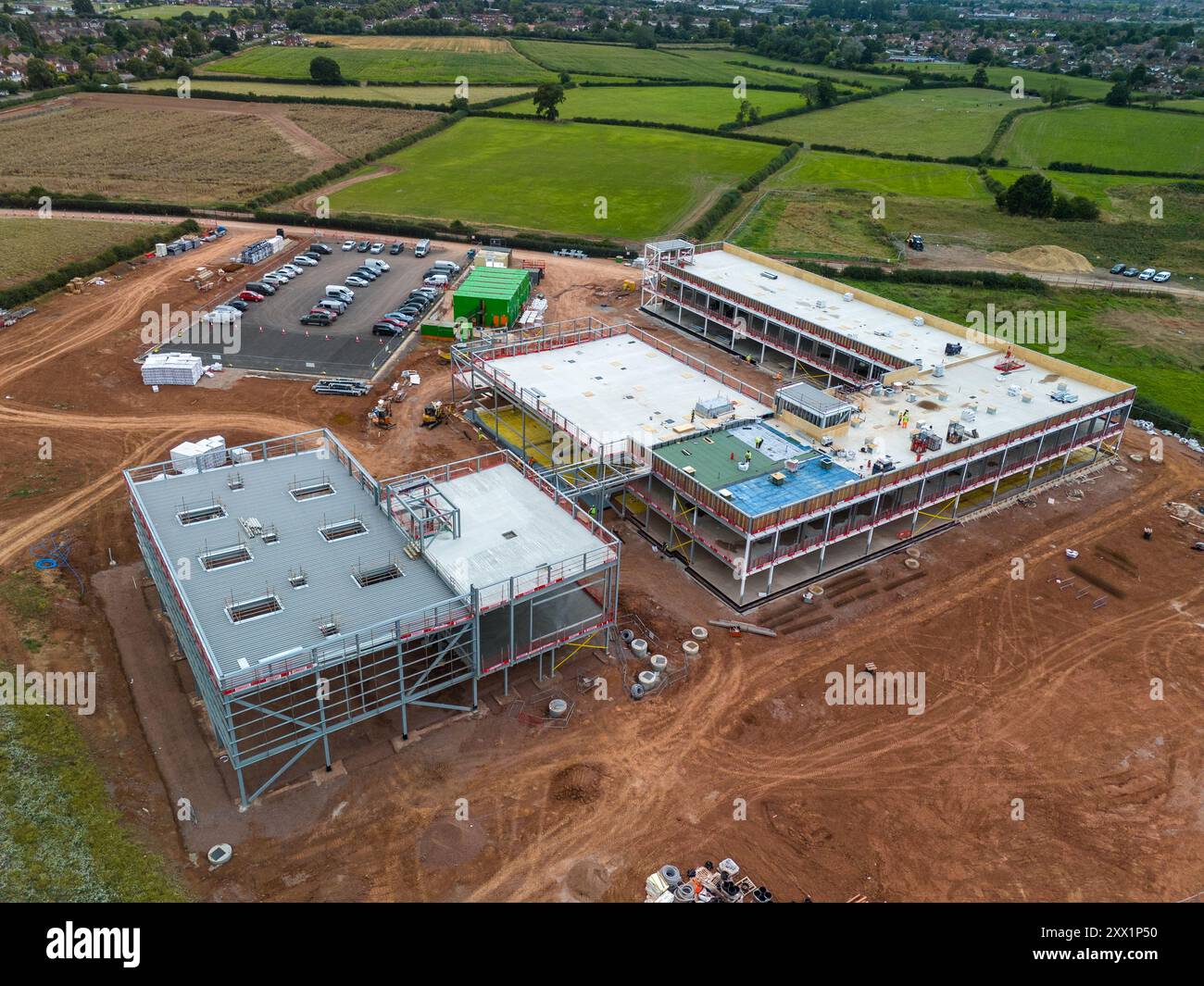 Aerial view of a modern steel school building complex during ...