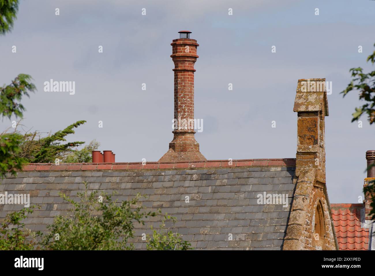 Tall Victorian brick house chimney Stock Photo - Alamy