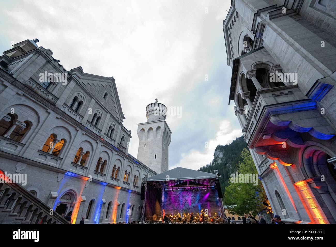 21 August 2024, Bavaria, Schwangau: Guests watch a concert in the open ...
