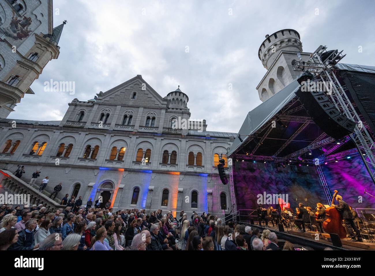21 August 2024, Bavaria, Schwangau: Guests watch a concert in the open ...