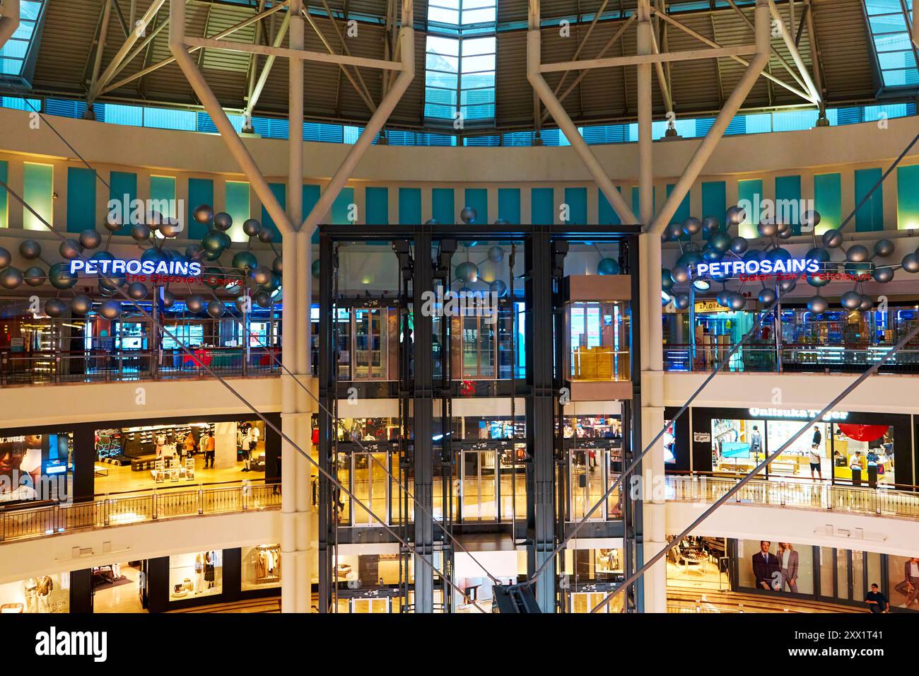 A modern interior inside a huge multi-storey shopping center. Kuala ...