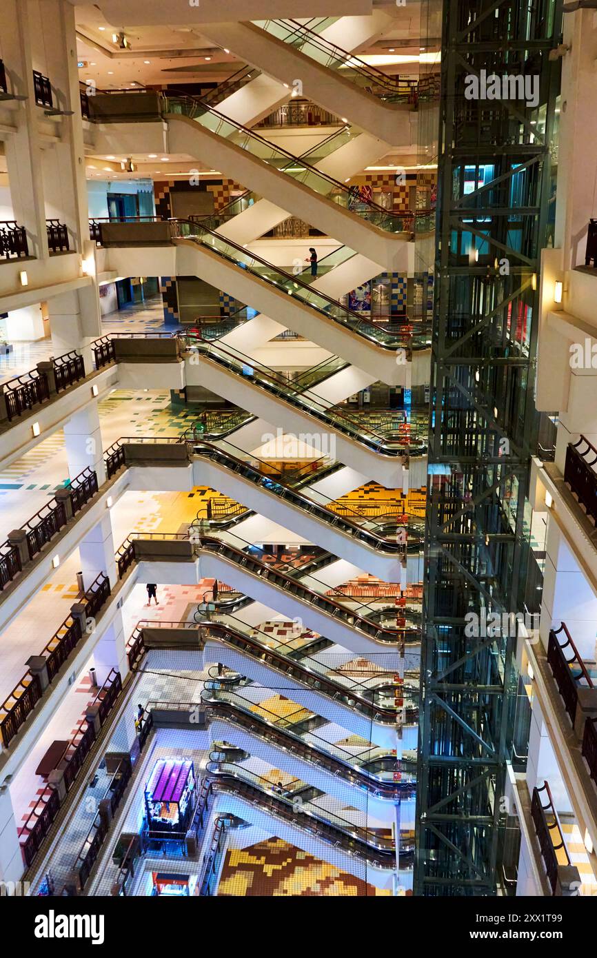 A modern interior inside a huge multi-storey shopping center. Kuala ...