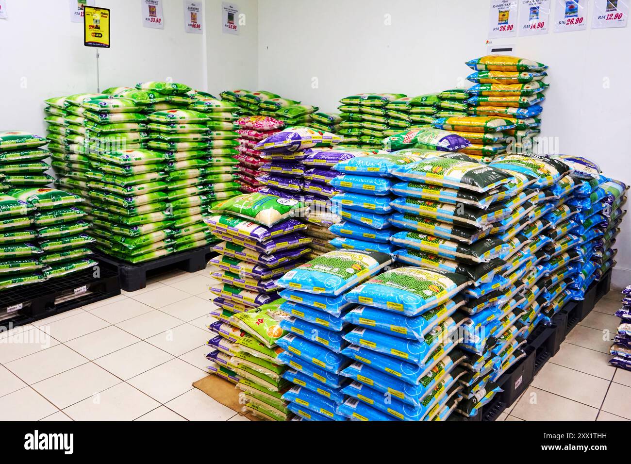 An assortment of different types of rice in large bags in an Asian ...