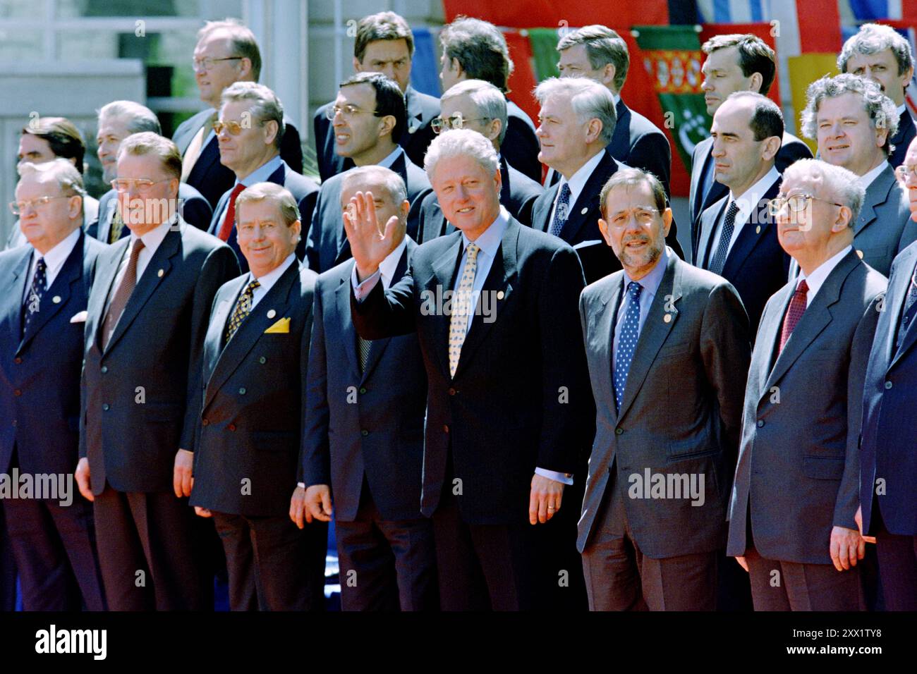 U.S. President Bill Clinton waves during the group photo of the NATO ...