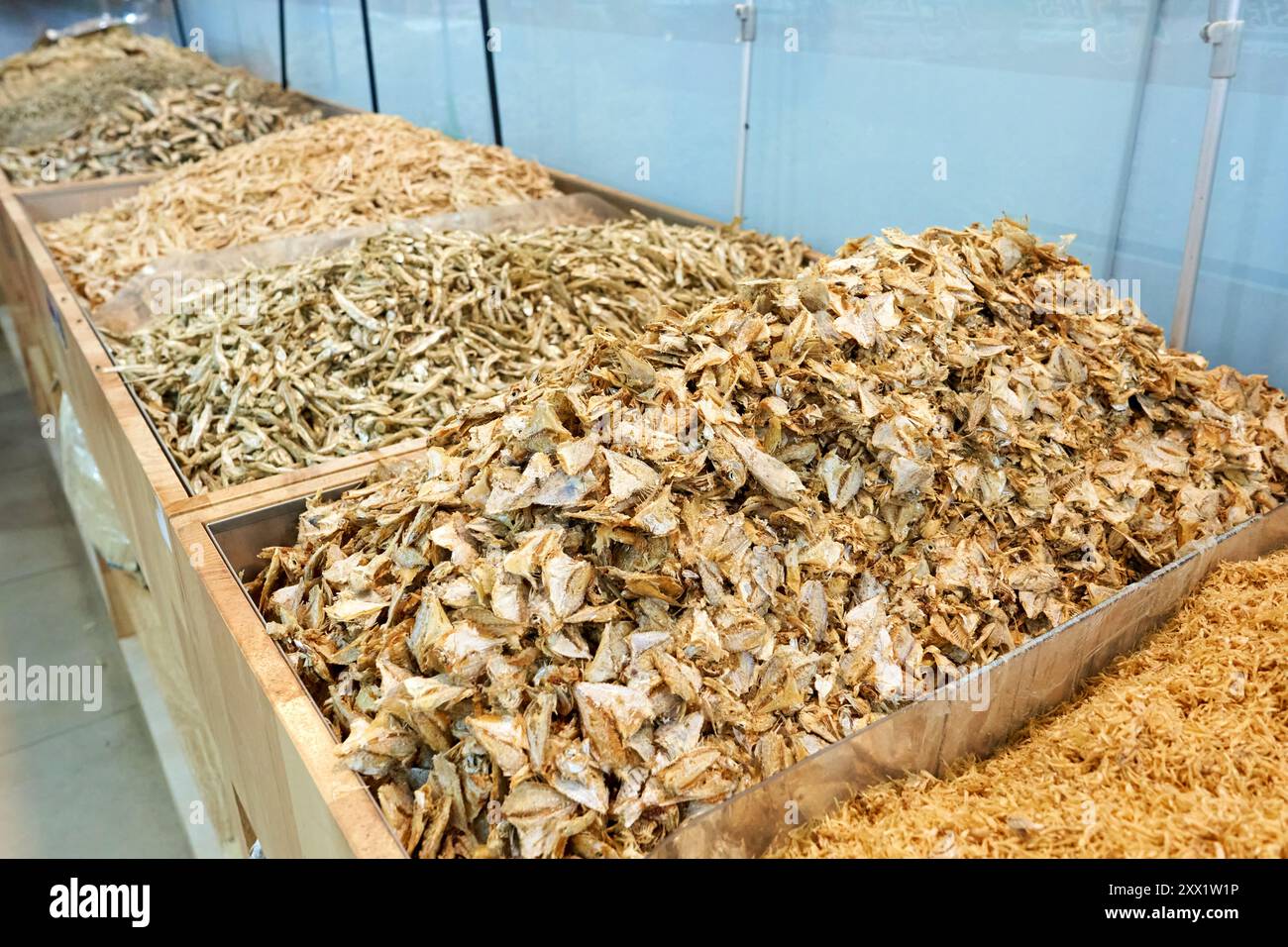 A large assortment of dried fish is on display in the Asian store Stock ...