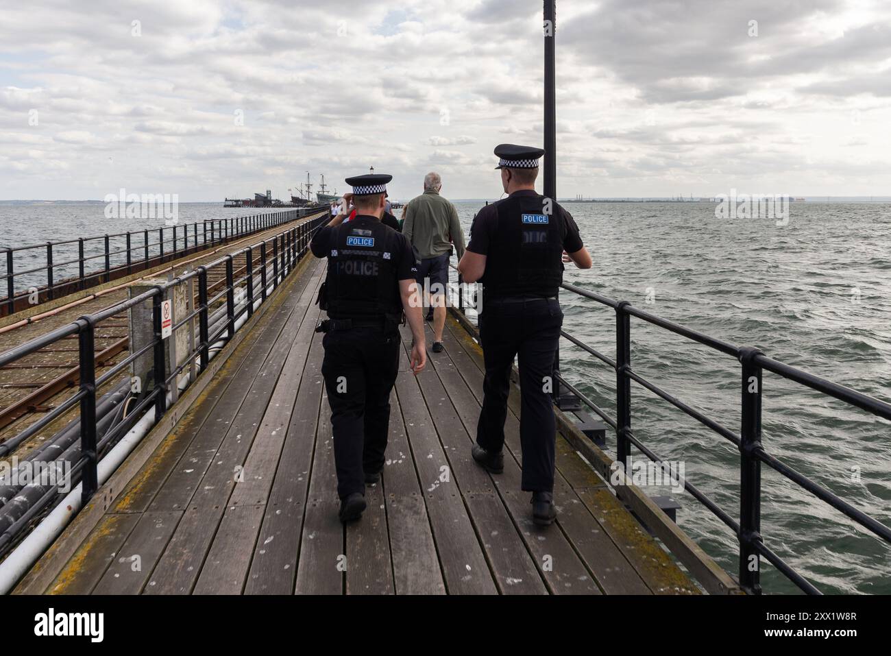Police officers patrolling on Southend Pier in the Thames Estuary off ...