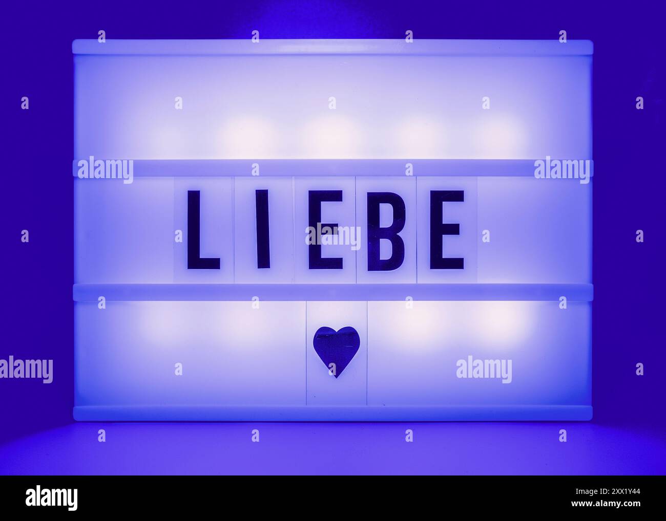 A lightbox displaying the word liebe, german for love Stock Photo - Alamy