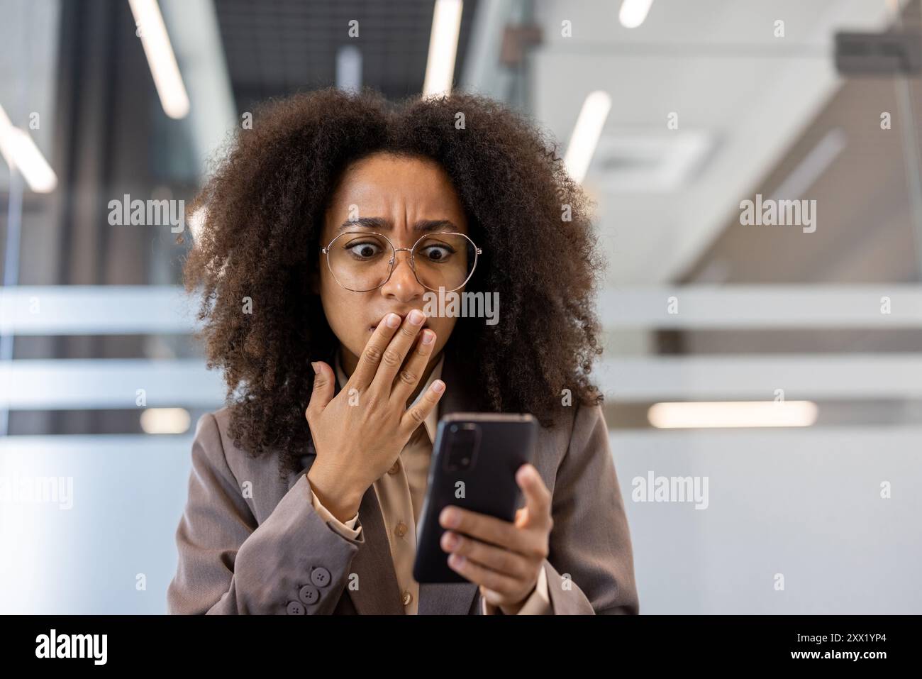 Close-up photo of a young African-American scared woman standing in a ...