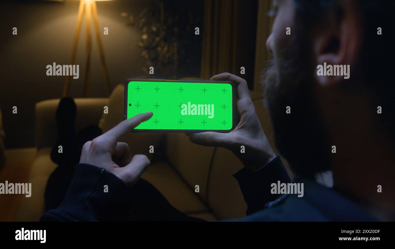 Home man hand tapping screen hi-res stock photography and images - Alamy