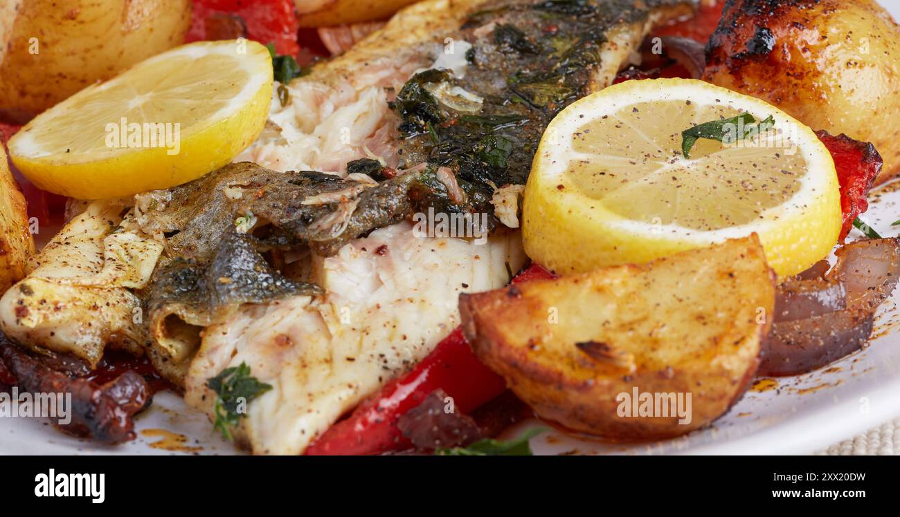 Pan seared fish fillet with roasted vegetables Stock Photo - Alamy