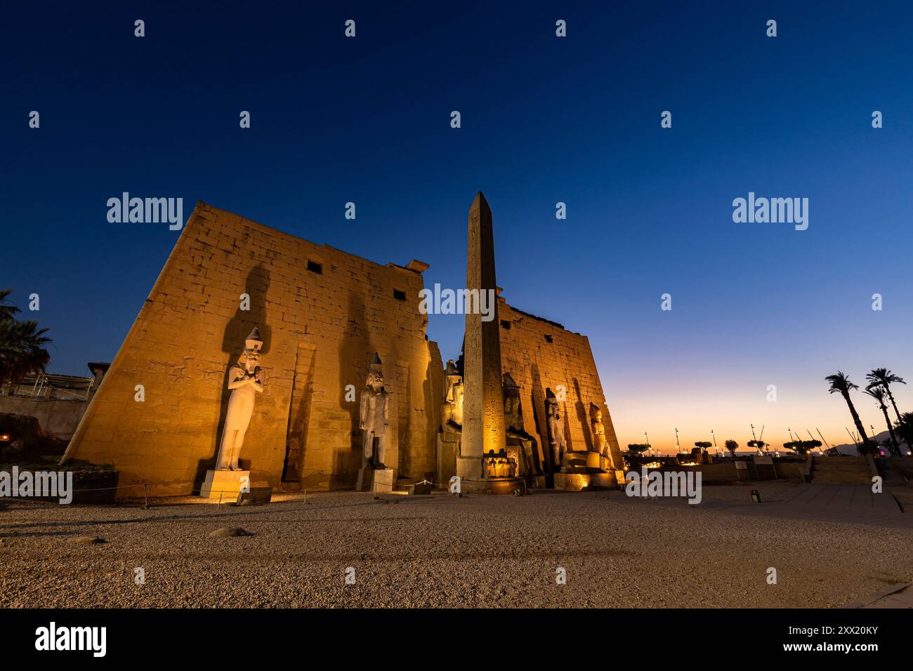 Luxor temple, Lighting of first pylon, evening twilight, Luxor, Egypt ...