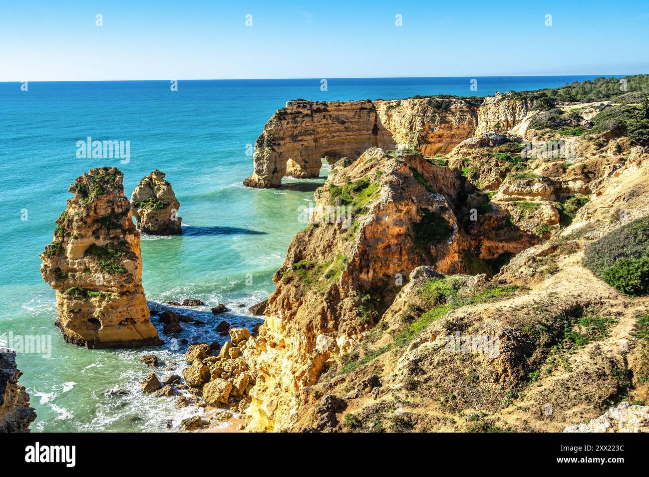 Praia da Marinha Beach among rock islets and cliffs seen from Seven ...