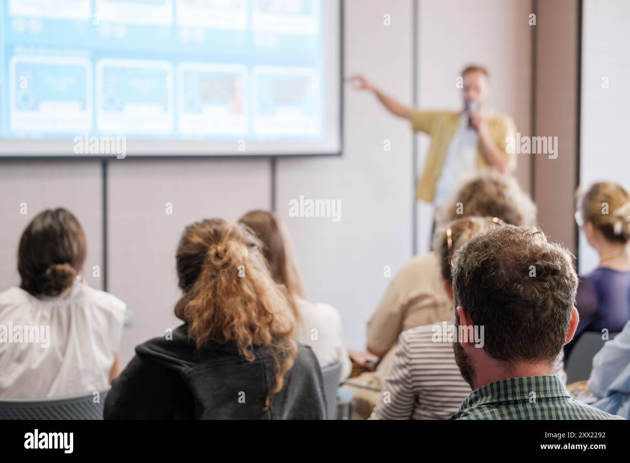 Group of people engaged in a professional seminar with speaker ...