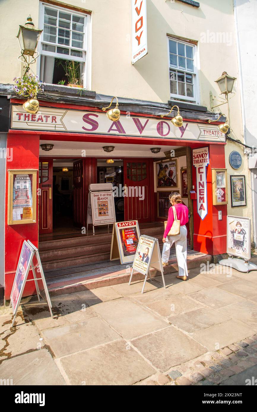 Woman about to enter the Savoy cinema and theatre in church Street ...
