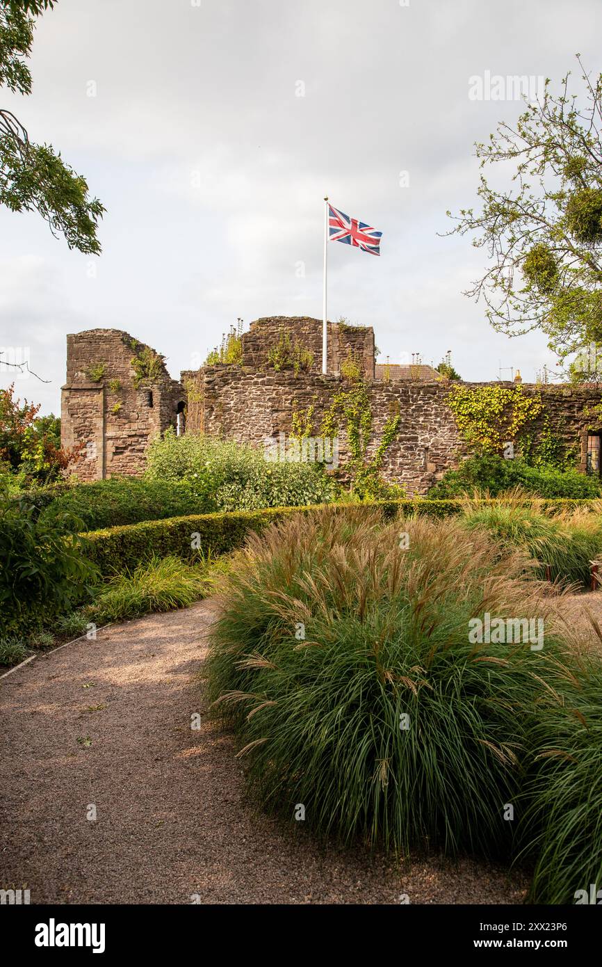 The garden of remembrance and castle ruins in the Welsh town of ...