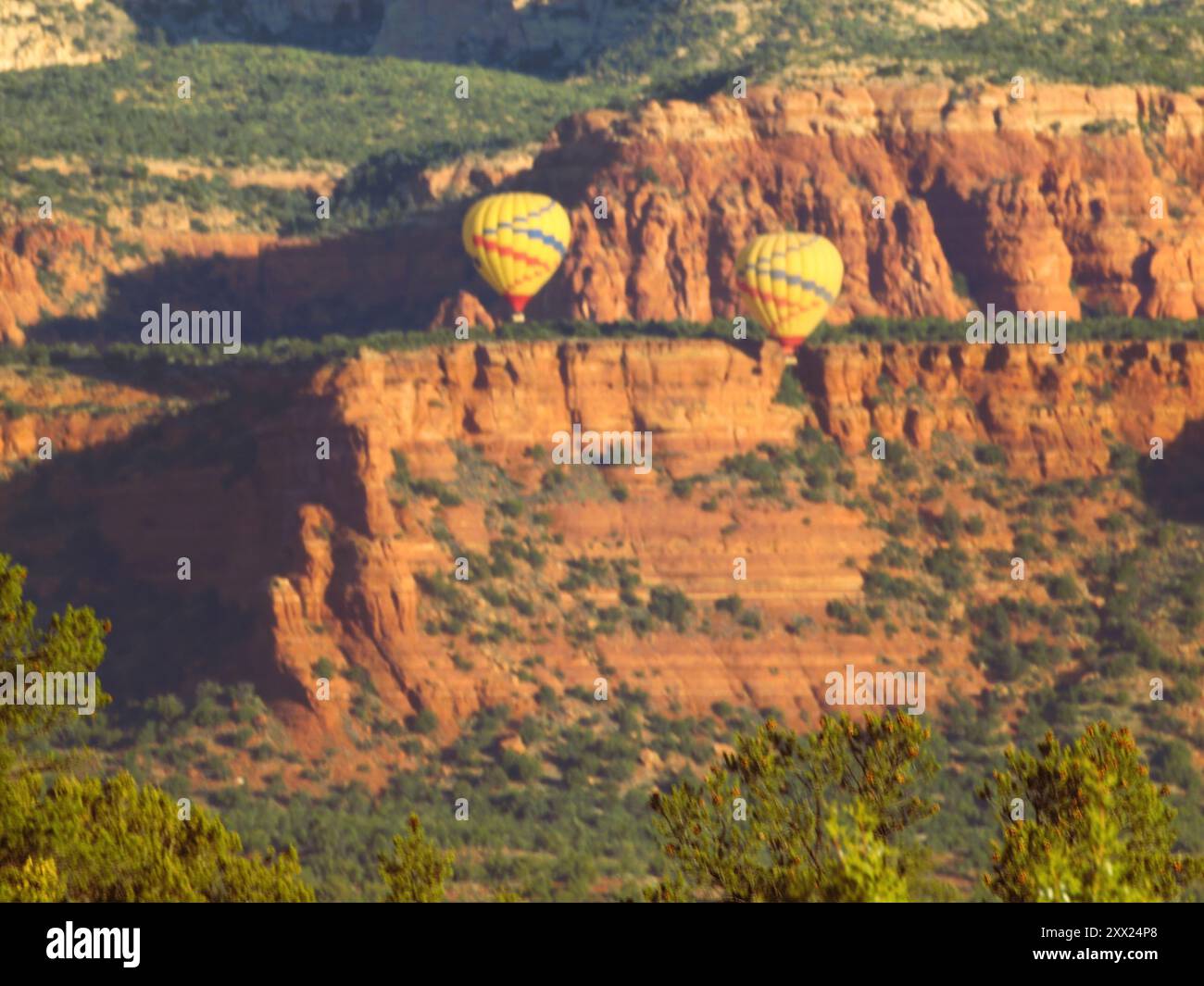 Two hot air balloons and Arizona red rocks Stock Photo - Alamy