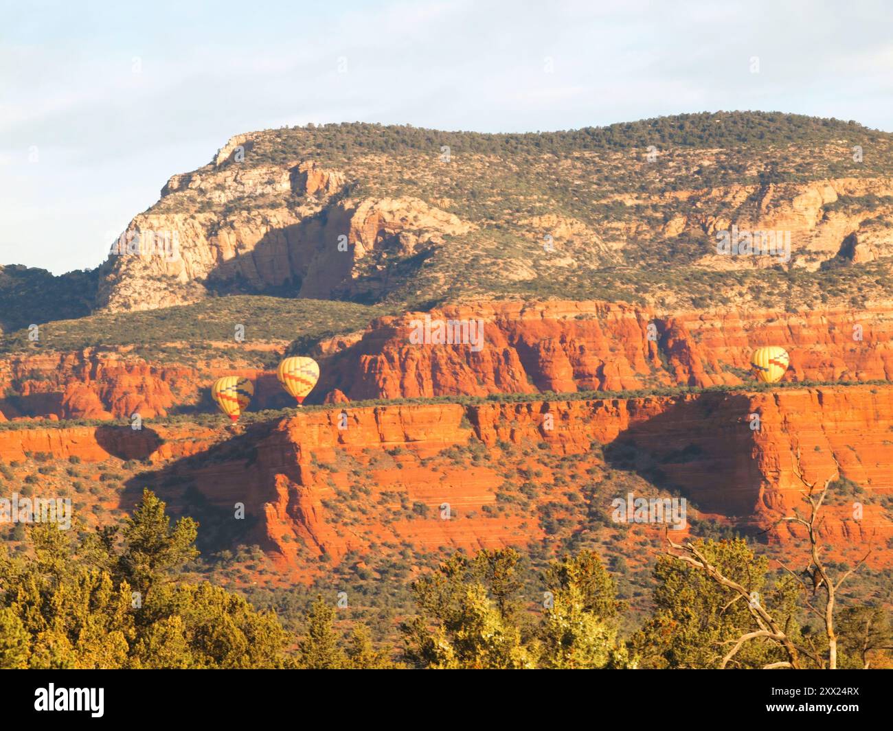 Three hot air balloons and Arizona red rocks Stock Photo - Alamy