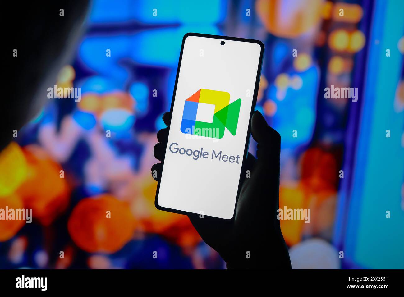 In this photo illustration, the Google Meet logo is displayed on a ...